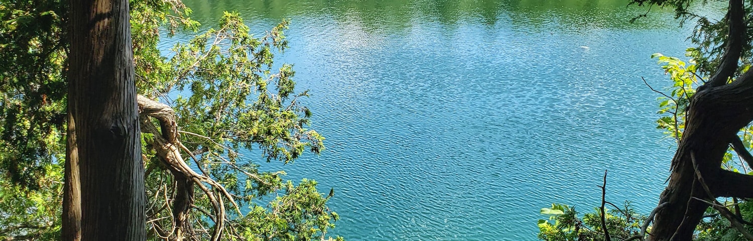 Land owned by the Crawford family in the 1800s, built a lumber mill at the end of the lake and later used as a summer retreat.  Years later, sold to Conservation Halton for preservation of the beautiful lake!