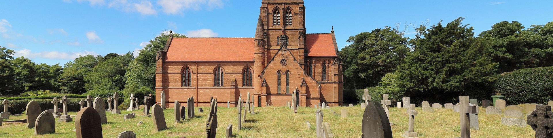 View north across the churchyard to St Bartholomew's, Thurstaston