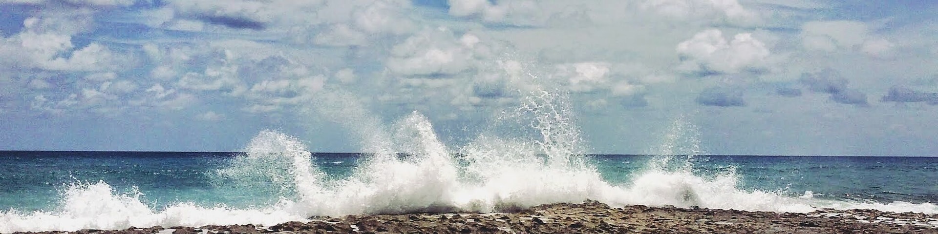 The shoreline at Riviera Beach in Florida is dotted with patches of Anastasia Limestone which causes the water to shoot up like a geyser when the waves crash against them. #Wanderlust #Explore #Travel #Beach #Florida