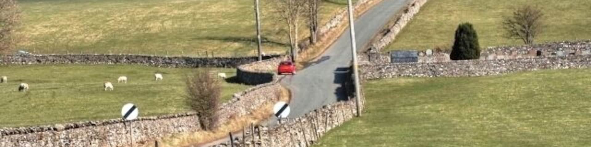 Road to Crosby Ravensworth Passing the cemetery on the right.