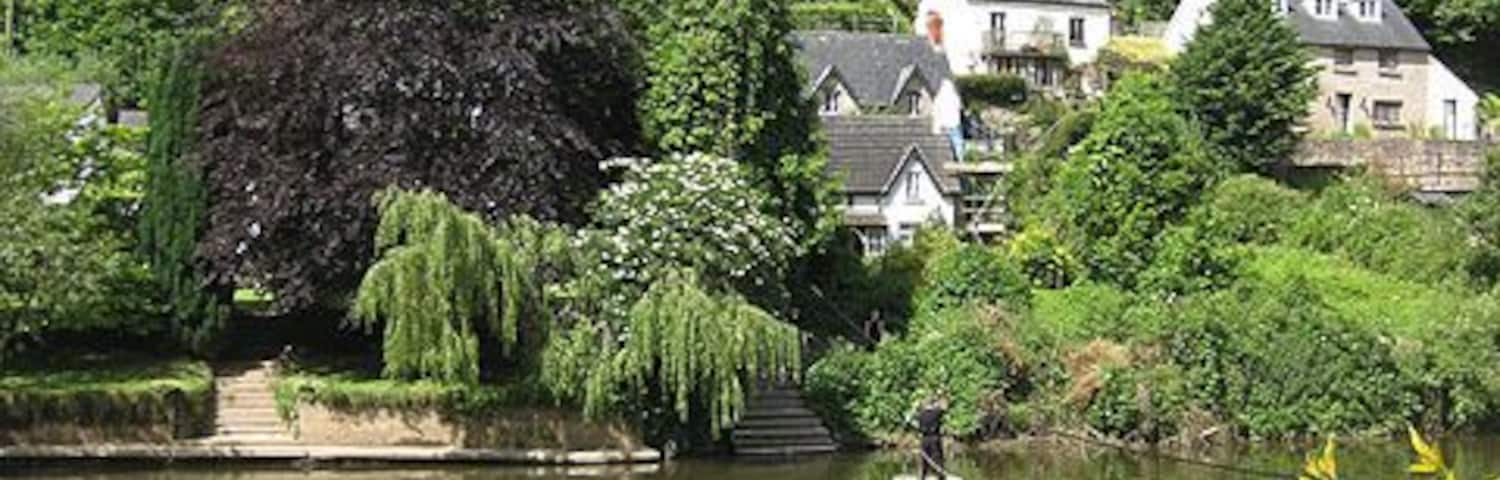 The ferryman The hand-hauled ferry sets out on its first trip of the day across the River Wye from Symonds Yat East to Symonds Yat West. A passenger waits on the seat on the far bank.