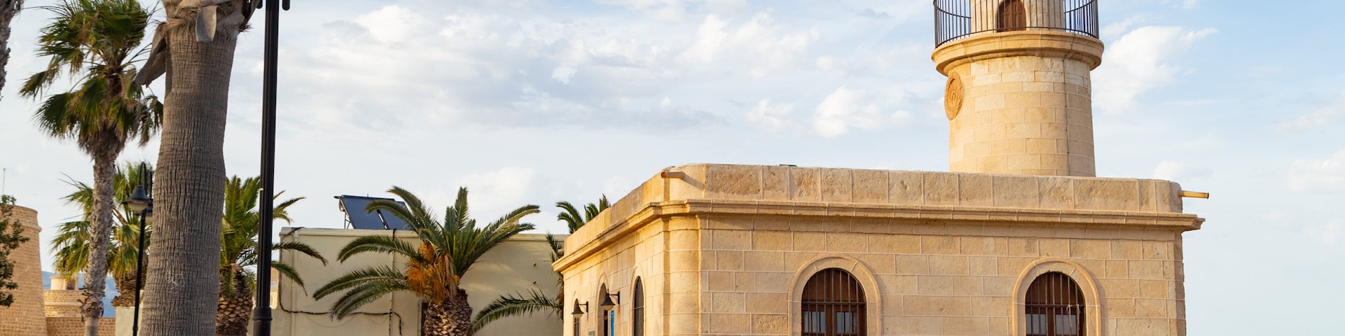 Roquetas de Mar which includes a lighthouse and a coastal town