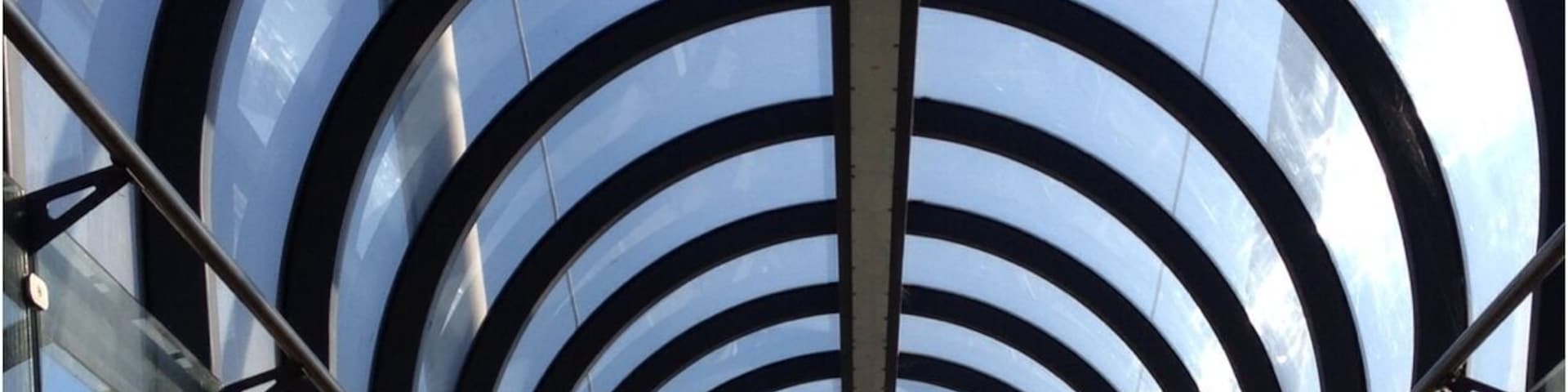 A sunny fall day makes a boring highway pedestrian bridge appear like an architecural masterpiece.