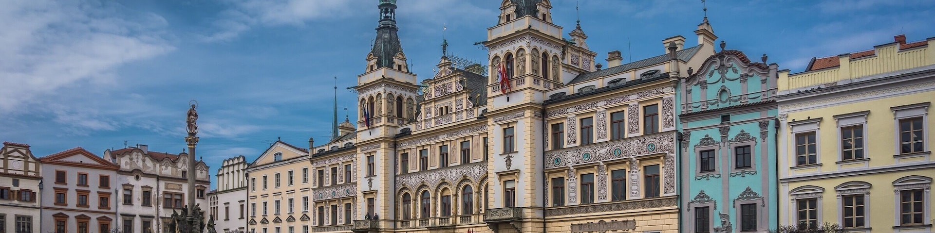 Pardubice became a town sometime around 1340. Back then it was owned by the Lords of Pardubice, the most prominent figure of the line being Arnošt of Pardubice, the first Archbishop of Prague, advisor and friend to Emperor Charles IV, a distinguished European personality of that time. Buildings on the square and adjacent streets bear the oldest traces of early gothic architecture. The neo-renaissance city hall of Pardubice is the main focal point.
Arnošt of Pardubice, the Velká Pardubická Steeplechase, the Golden Helmet, gingerbread – this is just a brief list of what Pardubice is famous for in the minds of people in the Czech Republic and the entire world.
However, if you are not an enthusiastic historian, sports fan or culinary gourmand, you can catch up by reading the following crash course on the city. Pardubice lies on the point where the Labe and Chrudimka rivers meet and dates back to more than 700 years.
The emblem, which Pardubice has been using as its symbol since the 12th century, is created from a silver horse on a red background. The city experienced its greatest flourishing during the time, when the estate belonged to the noble family the Pernštejns, who gave the historical centre of Pardubice’s its appearance. They say that Pardubice is a city of sports, horses and gingerbread, and it can also be considered the city of transportation. The historically first railway route from Olomouc to Prague leads through here, an international airport is situated here, you can reach the city by car and perhaps even by boat soon. So, now you know how to get to Pardubice.
#europe #czech #czechrepublic #city #cityscape #gothic #architecture #travel #history #instone #details