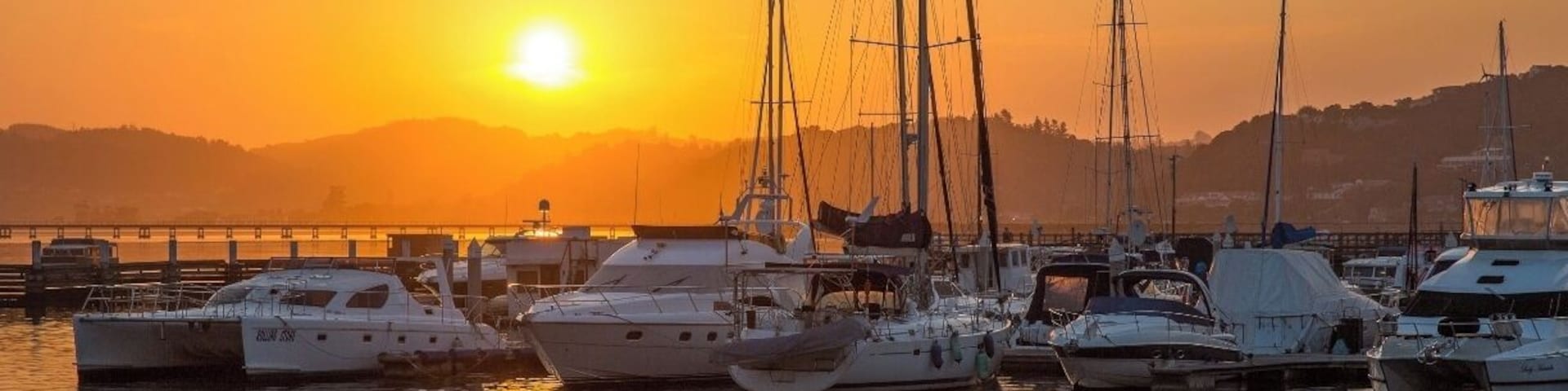 Sunset at the waterfront in Knysna. The waterfront area is one of the best places to eat in Knysna, and our two favorite restaurants are Caffe Mario (Italian) and 34 South (little bit of everything and also great oysters!).