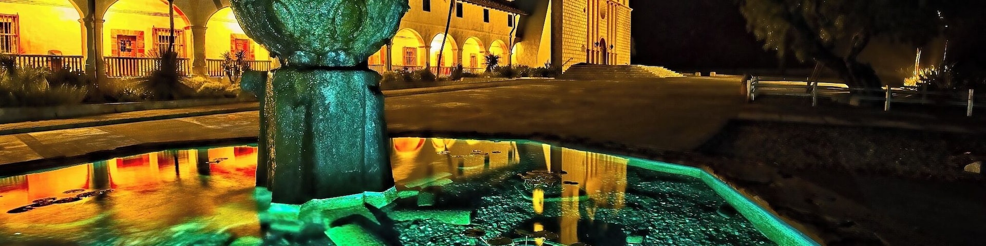 In the foreground is the fountain of the Old Mission Santa Barbara. This fountain was built in 1806 by the local Chumash Indians under the guidance of the Franciscans and is older than much of the main building which, most recently, had the two towers rebuilt in 1927 following earthquake damage.