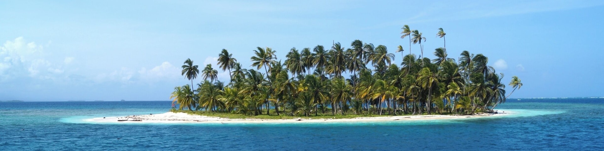 One of the many tiny islets of San Blas. Best to be explored on a sailing cruise from Panama to Colombia.