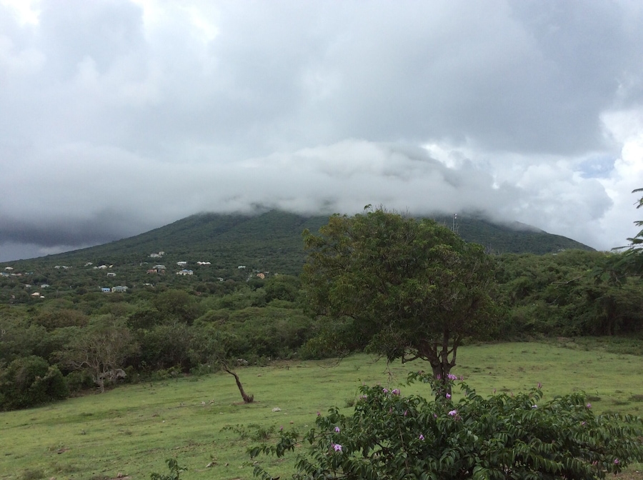 Cloud sitting a top the mountain