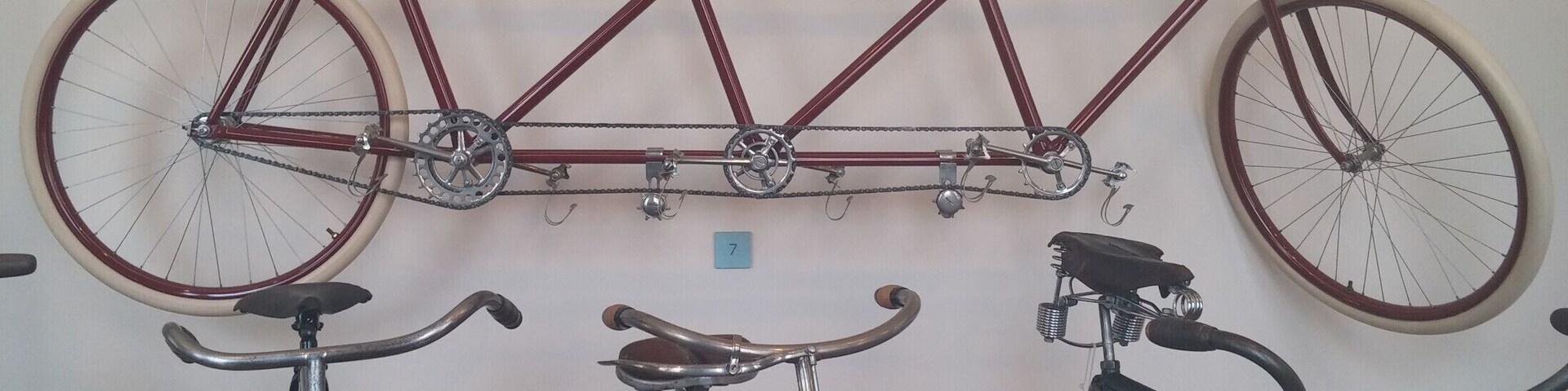 The city of Dayton played an important role in the history of the bicycle. The Wright Brothers owned a bicycle shop before delving into aviation. Huffy brand bicycles started in Dayton.
Carillon Historical Park has a building dedicated to bicycles including a couple penny farthings, a bone shaker, a Huffy radio bike and this triple tandem gem.