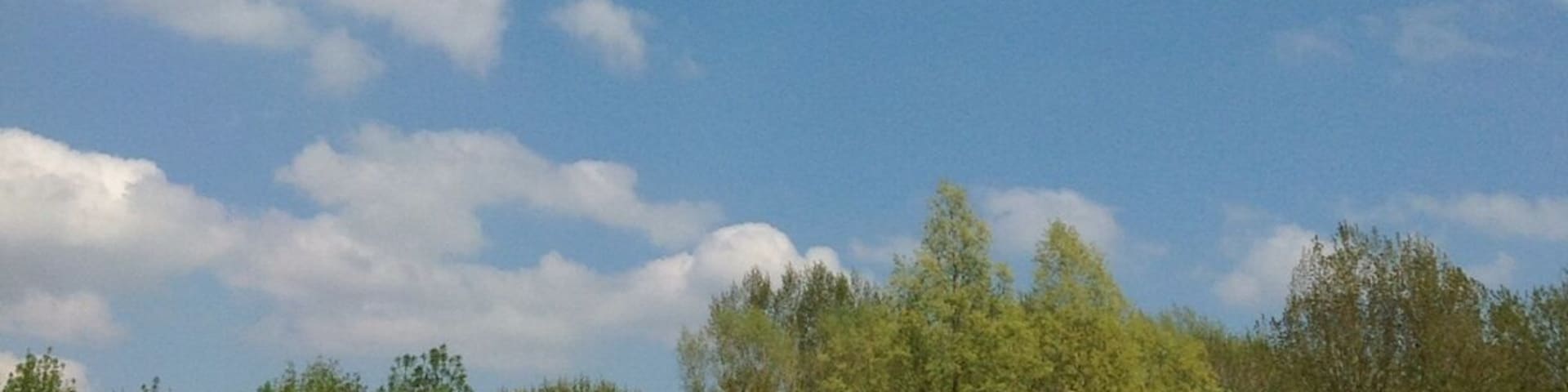 Mountainous clouds complete the otherwise flat Dutch landscape