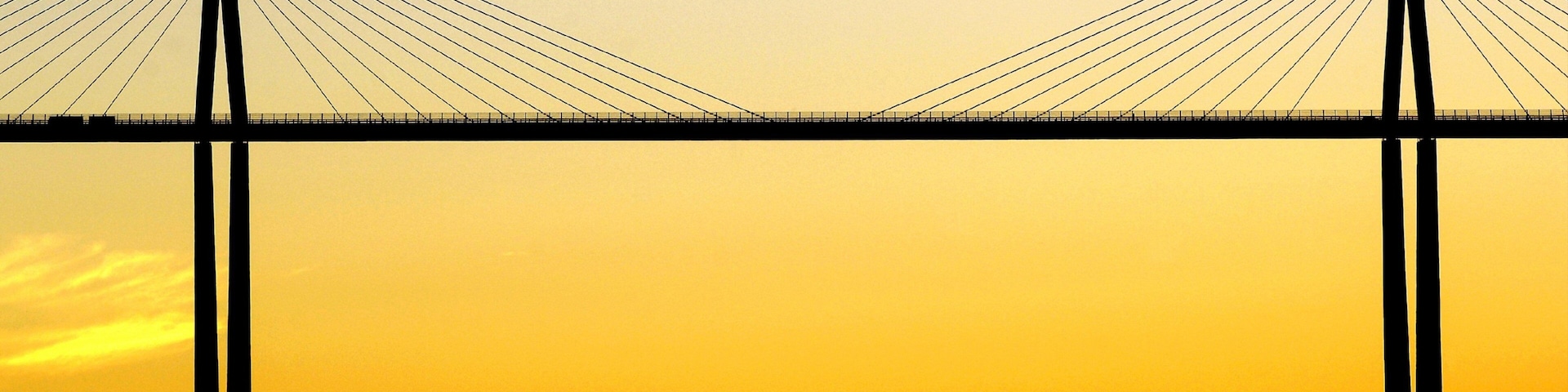 Millau featuring a sunset and a bridge
