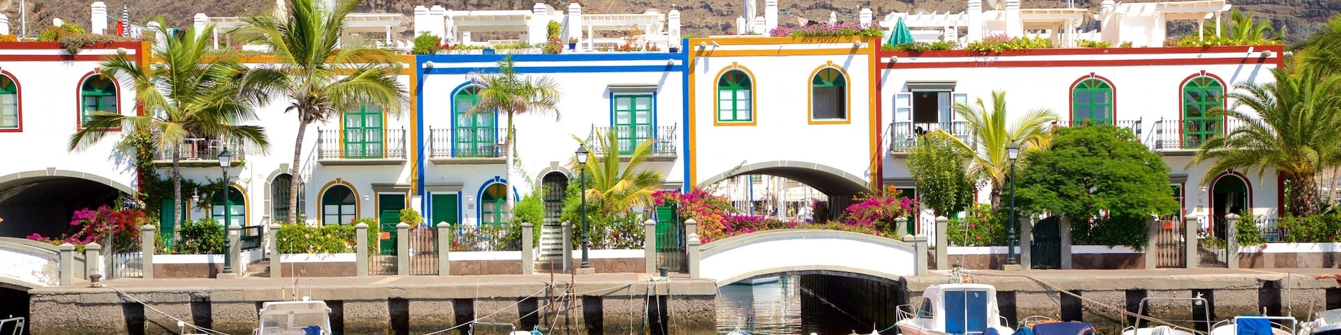 Mogan showing a bay or harbor, boating and a coastal town