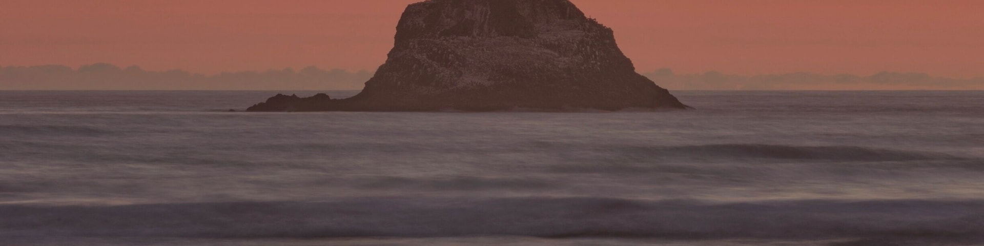 These rock outcroppings are scattered all over the coast. For sunset just sit back and enjoy the view.