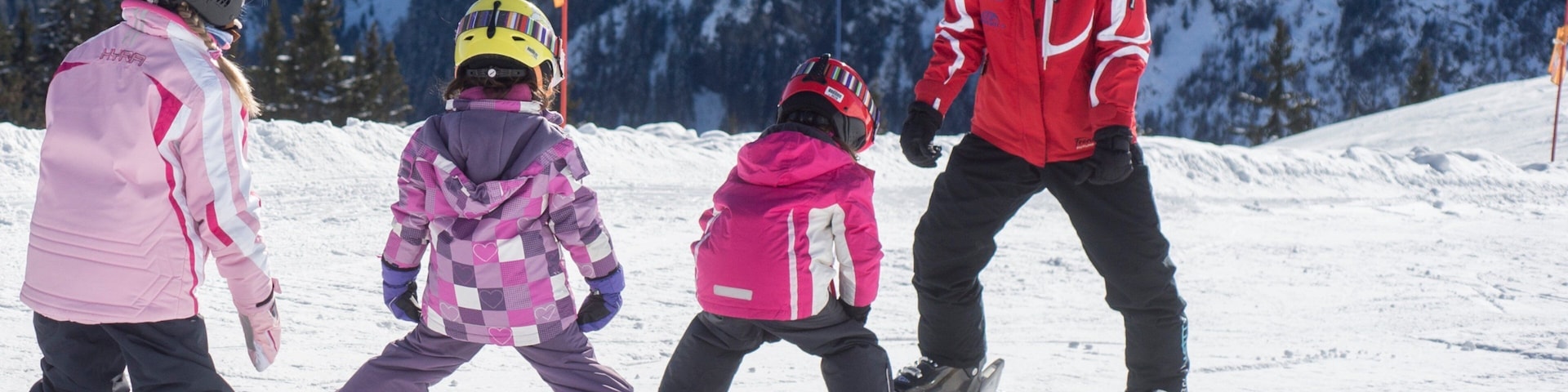 See showing snow skiing and snow as well as children