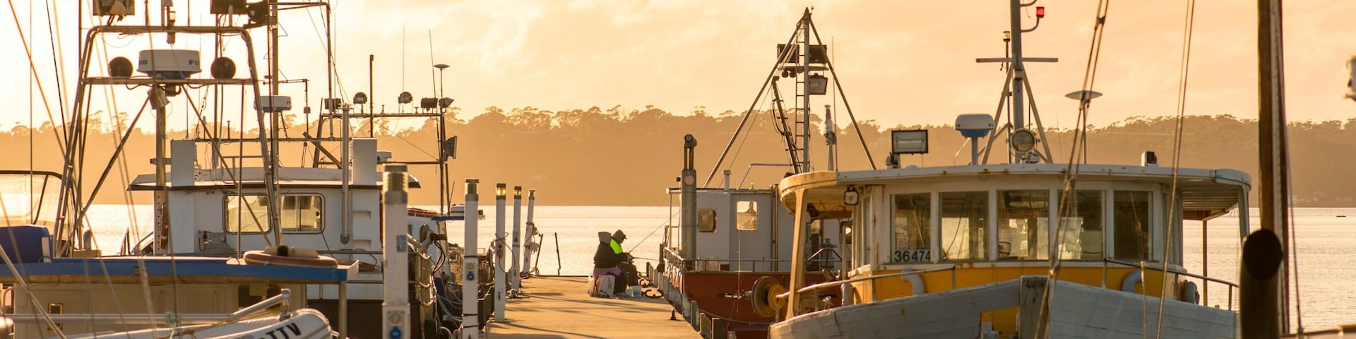 St Helens which includes a bay or harbor, boating and a sunset