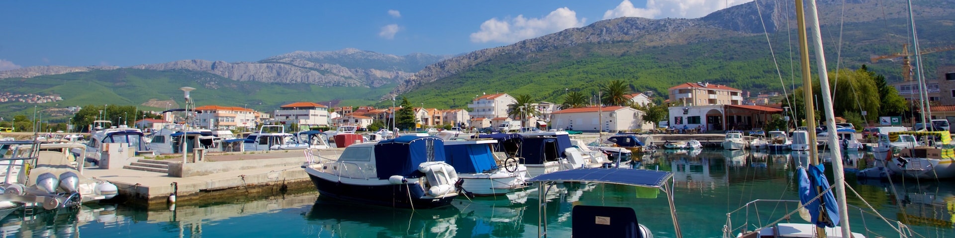 Podstrana featuring a marina and landscape views