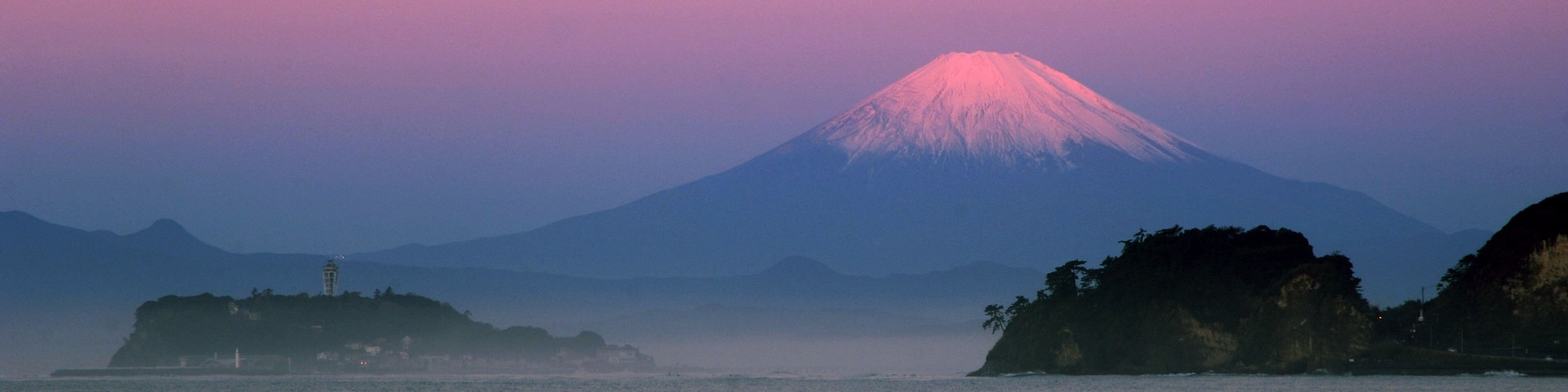 Kamakura which includes general coastal views, a sunset and landscape views