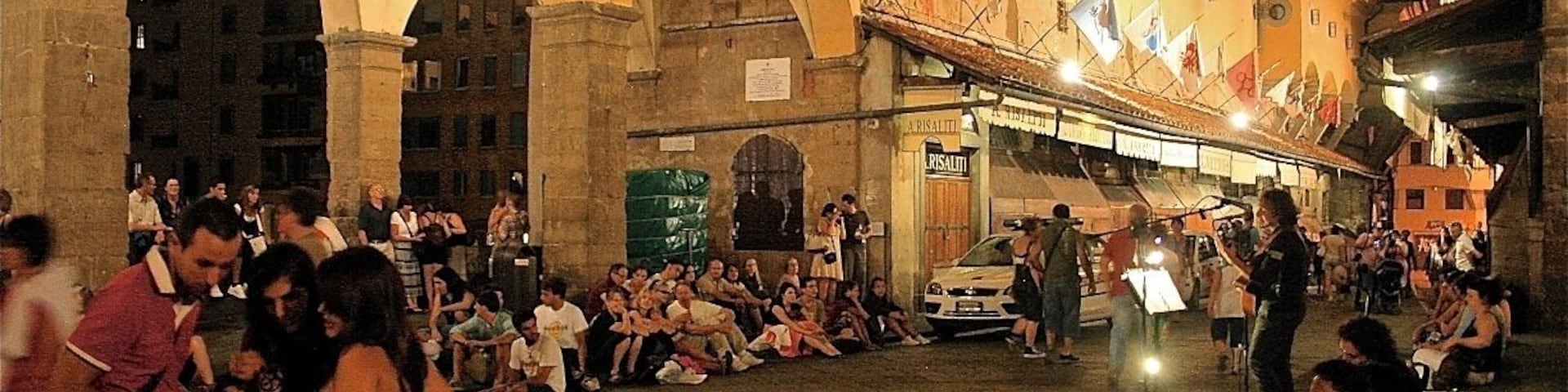 Taken at night while troving around Florence. I decided to chill like the rest of the crowd and sat listening to the musician playing the guitar and singing. He did a good job at entertaining us.