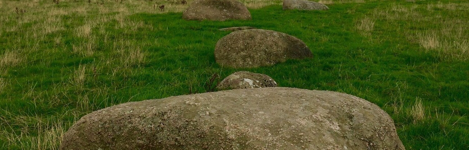 Gamelands stone circle with Orton Scar behind it.