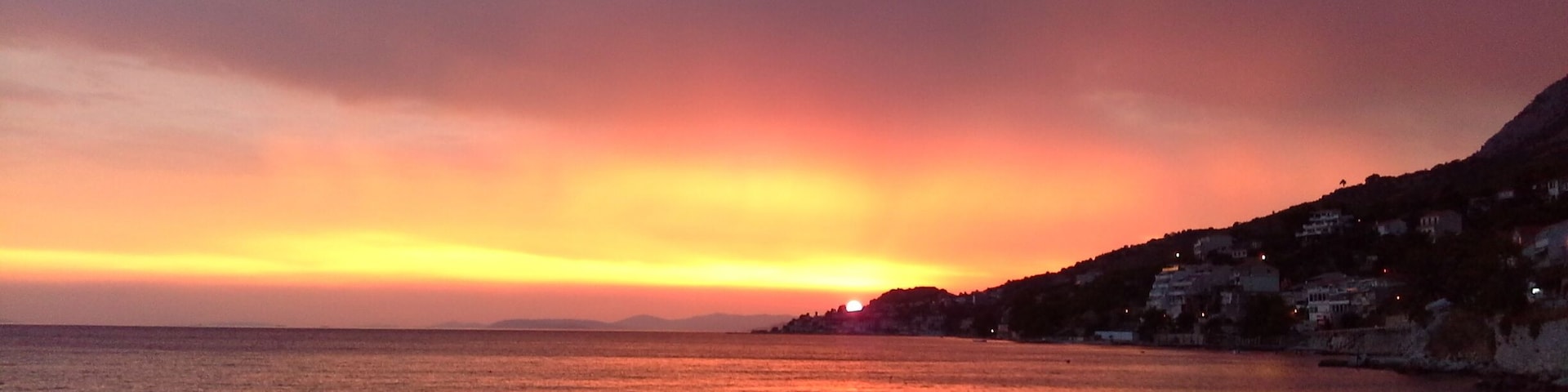 A rare stunning red sunset at Suhi Potok a result of storms brewing over Split.
