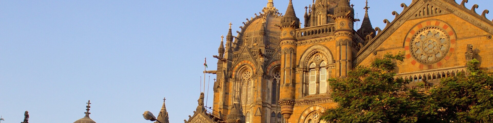 Mumbai which includes a sunset and heritage elements