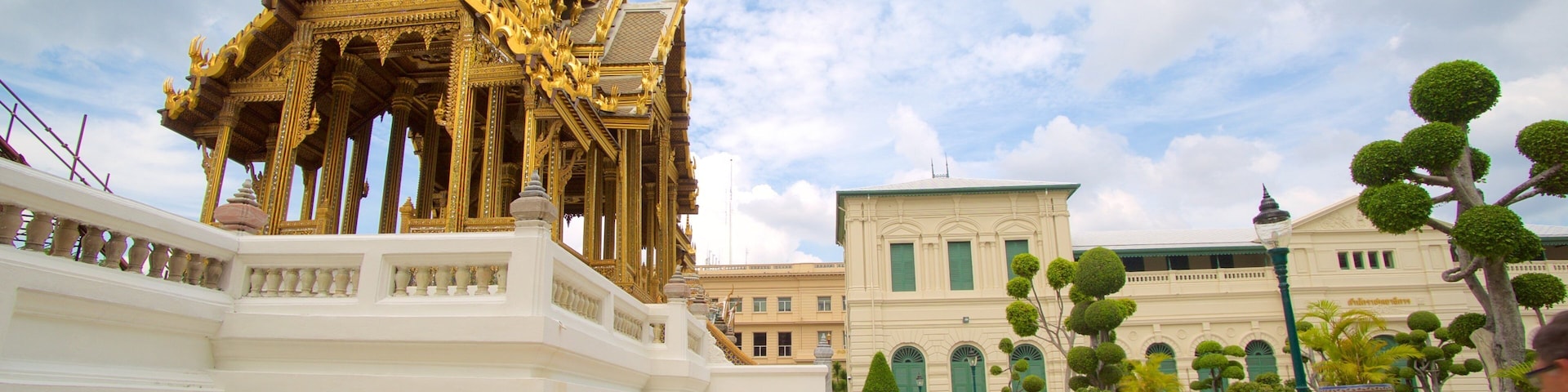 Grand Palace featuring a temple or place of worship as well as a small group of people