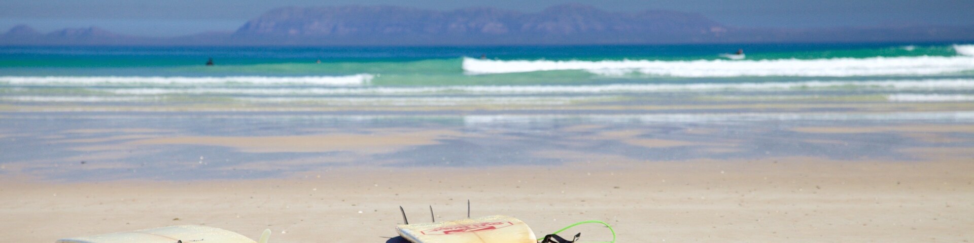 Strand which includes general coastal views, a sandy beach and landscape views