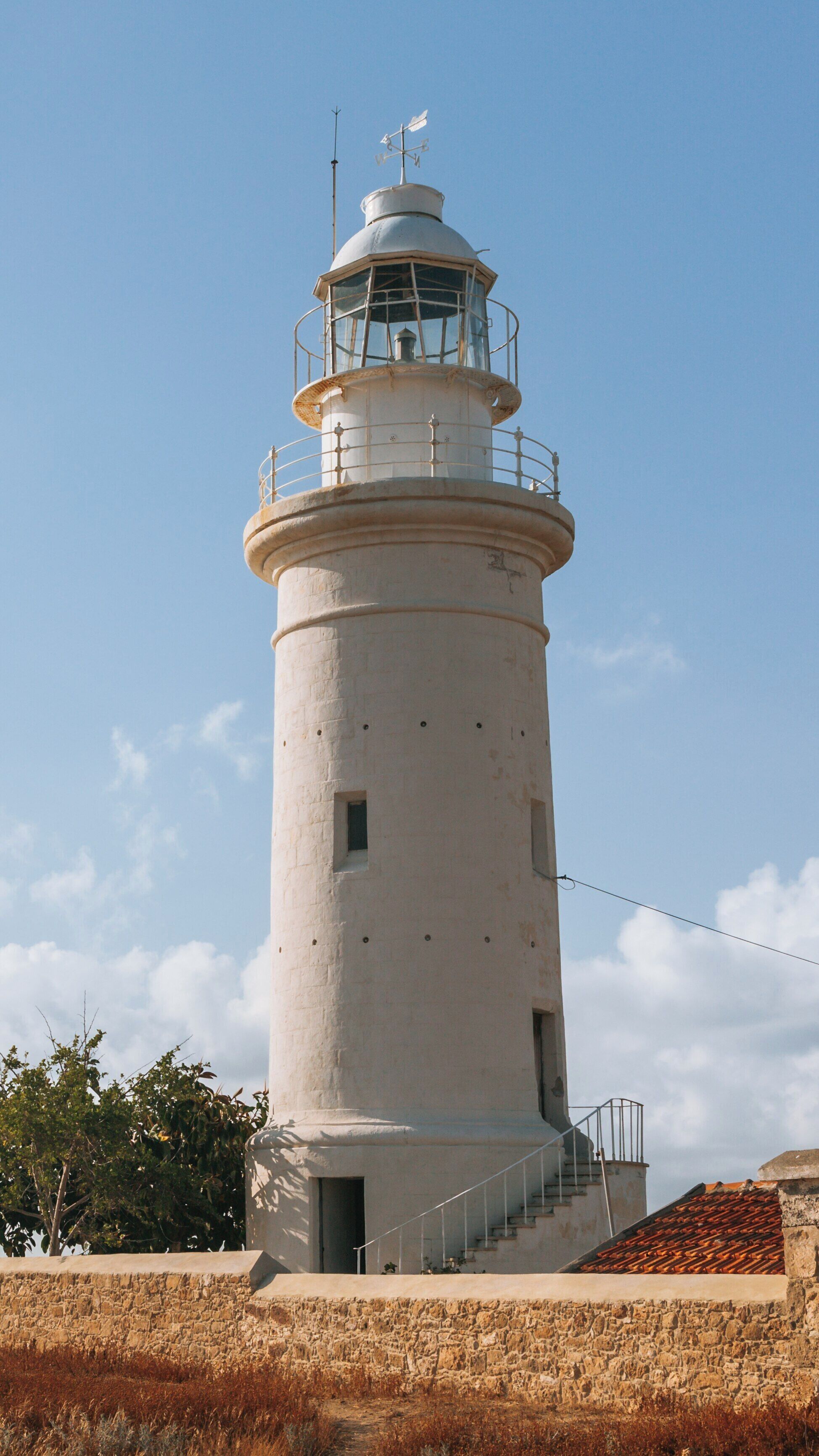 Explore Paphos Archaeological Park with its historic lighthouse and beautiful coastal scenery in Cyprus on a sunny day