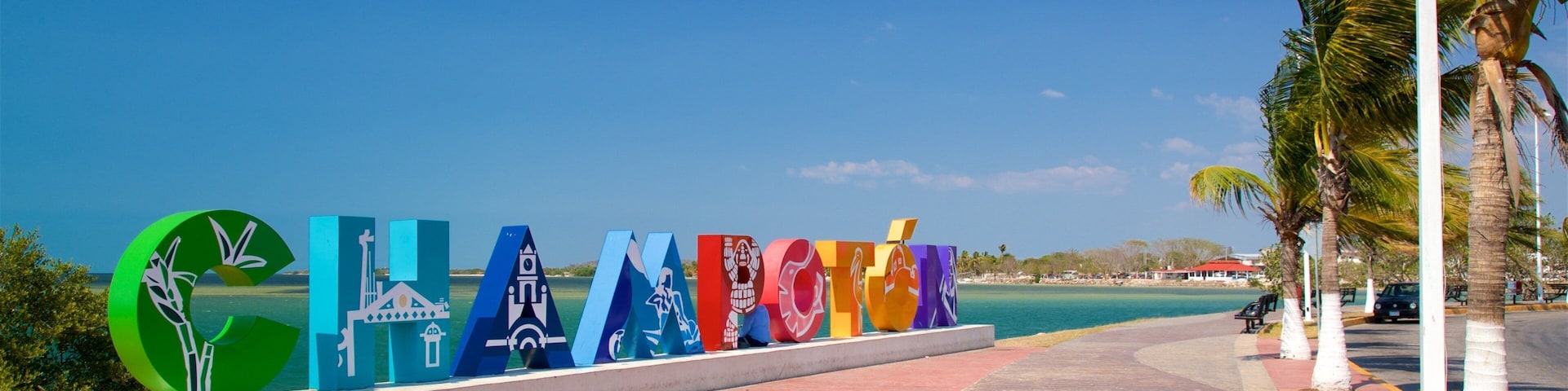 Champoton showing general coastal views, tropical scenes and signage