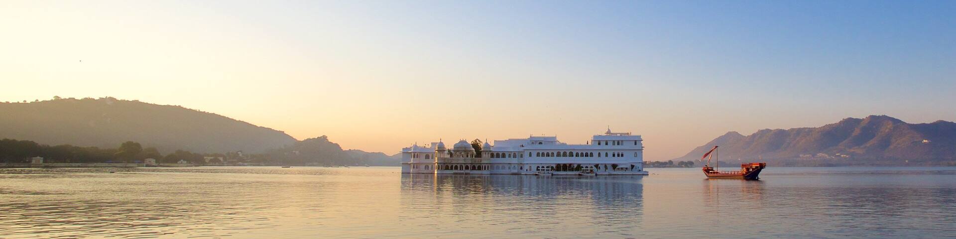 Udaipur District showing island images, a sunset and a lake or waterhole