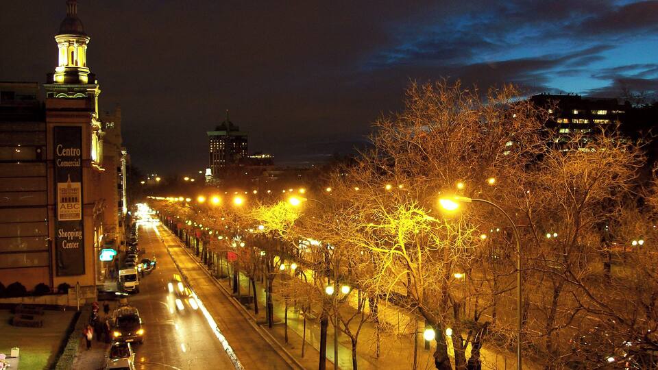 Night view of Paseo de la Castellana (avenue) in Madrid (Spain) from Puente de Enrique de la Mata Gorostizaga (bridge, Salamanca district). In the background, Plaza de Colón ("Columbus Square").