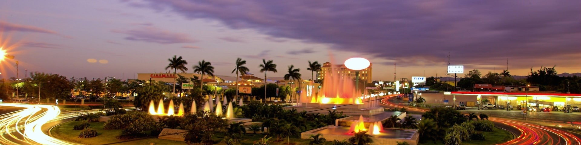 Managua which includes a city and a sunset
