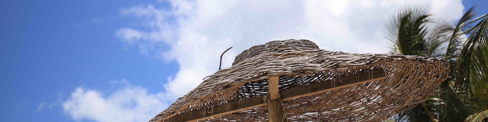 Umbrella in front Bar Uxua .The best day use in Trancoso. Ask about “caipirinha “ drink.