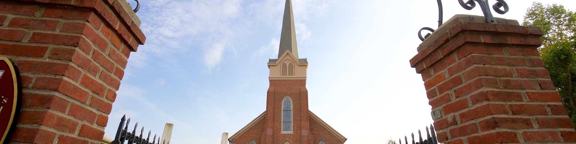 Lewes mostrando um cemitério, uma igreja ou catedral e um pôr do sol