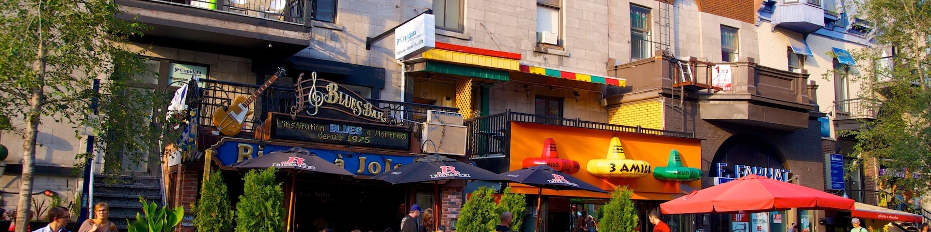 Latin Quarter which includes outdoor eating, cafe lifestyle and a city