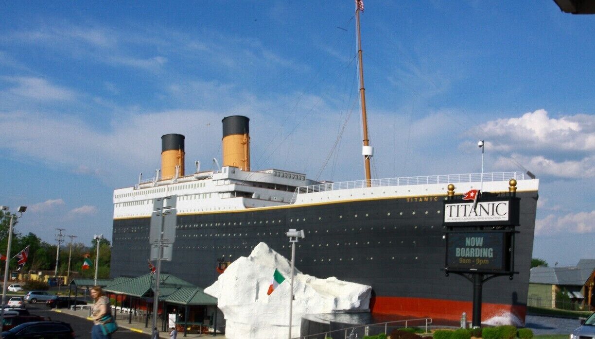 The Titanic Museum Attraction is a museum located in Branson, Missouri on 76 Country Boulevard. It is one of two Titanic-themed museums owned by John Joslyn (who headed a 1987 expedition to Titanic's final resting place); the other is located in Pigeon Forge, Tennessee.
The two-story museum, opened in 2006, is shaped like the Titanic itself, but built half-scale to the original. It is anchored in water to create the illusion of the Titanic at sea. The museum holds 400 pre-discovery artifacts in 20 galleries.
The 90-minute, self-guided tour is designed to give guests the sensation of being an original passenger on Titanic’s 1912 maiden voyage. As guests step through the artificial iceberg into the museum, they are given a passenger boarding ticket, featuring the name of an actual Titanic passenger and the class on which the passenger traveled. During the tour guests learn the individual stories of several passengers. At the end of the tour, in the Titanic Memorial Room, the guest will find out whether his/her ticketed passenger survived or perished.