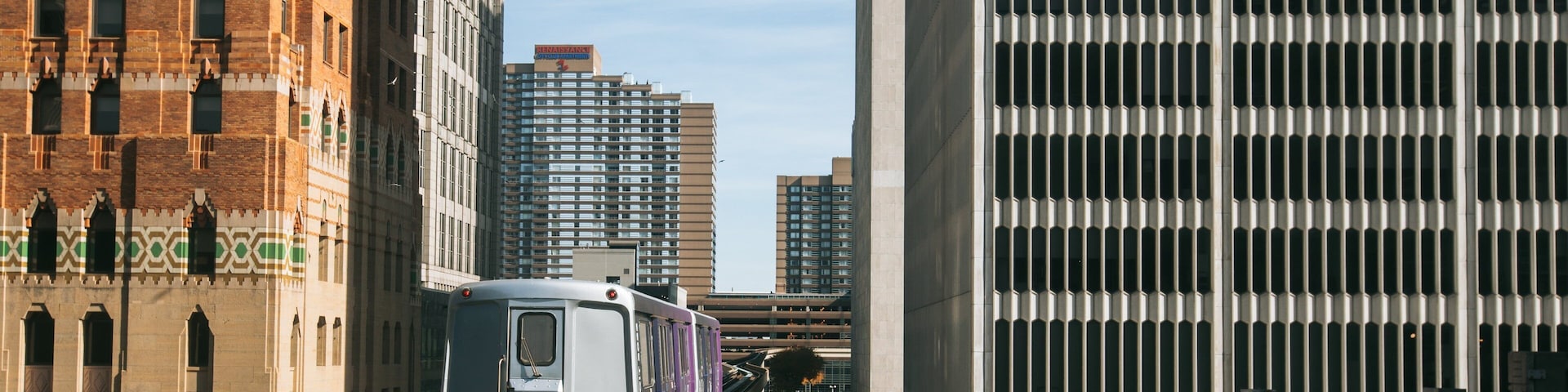 Downtown Detroit which includes a city and railway items