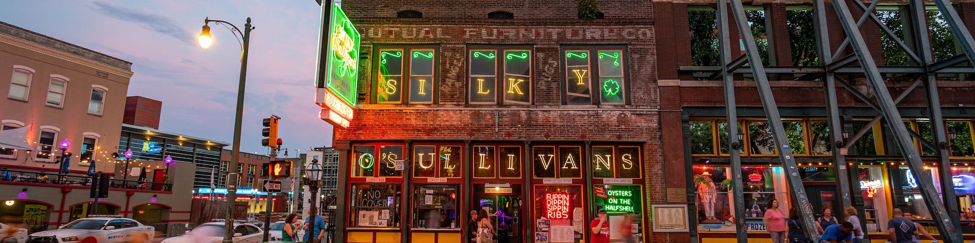 Downtown Memphis featuring a sunset and street scenes