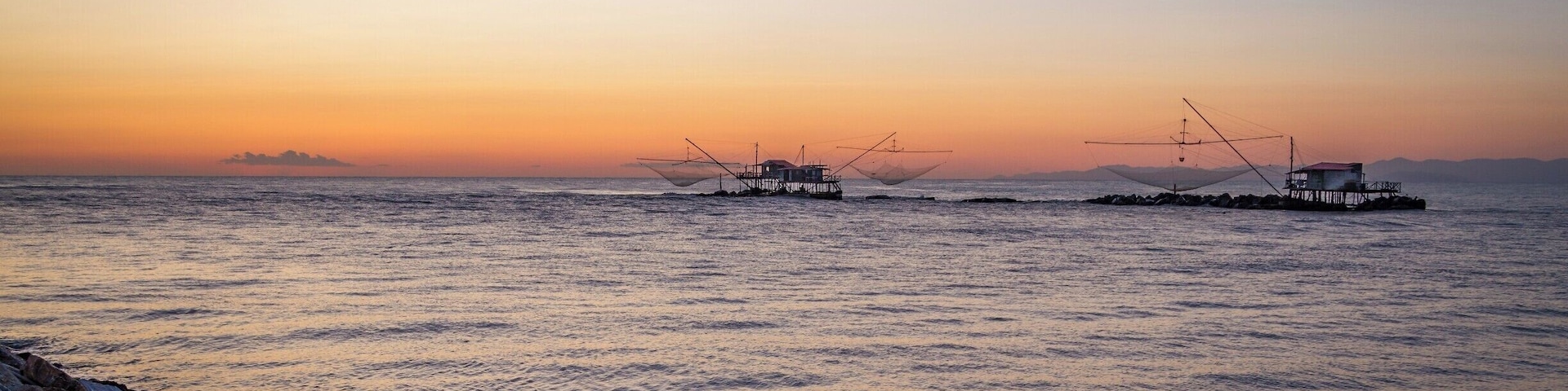 There is a lot more to Pisa than the famous Leaning Tower!
If you get some extra time, I would recommend you hit the Marina di Pisa. It is only a 20 mins drive from the city, and in my opinion it is worth the detour.
The walk at sunset by the Arno bank in the estuary is brilliant. This is from there that I got this photo of those fishing huts.
Also, the Yacht Club in the middle of the marina is an amazing spot to watch sunset and enjoy a Spritz!