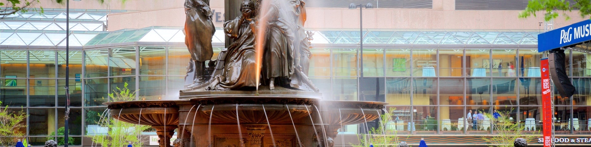 Downtown Cincinnati featuring a statue or sculpture and a fountain