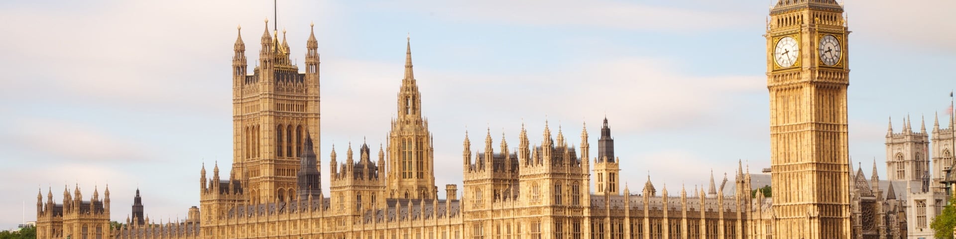 Majestic Big Ben and Houses of Parliament by the River Thames in London during a clear day