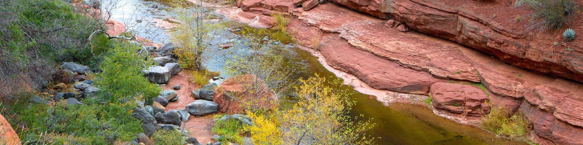 Slide Rock State Park showing a river or creek and a gorge or canyon