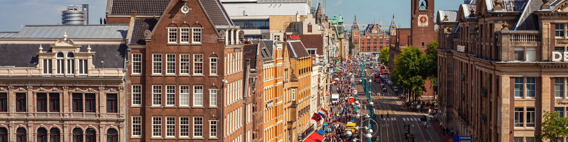 Dam Square which includes heritage architecture, street scenes and a city