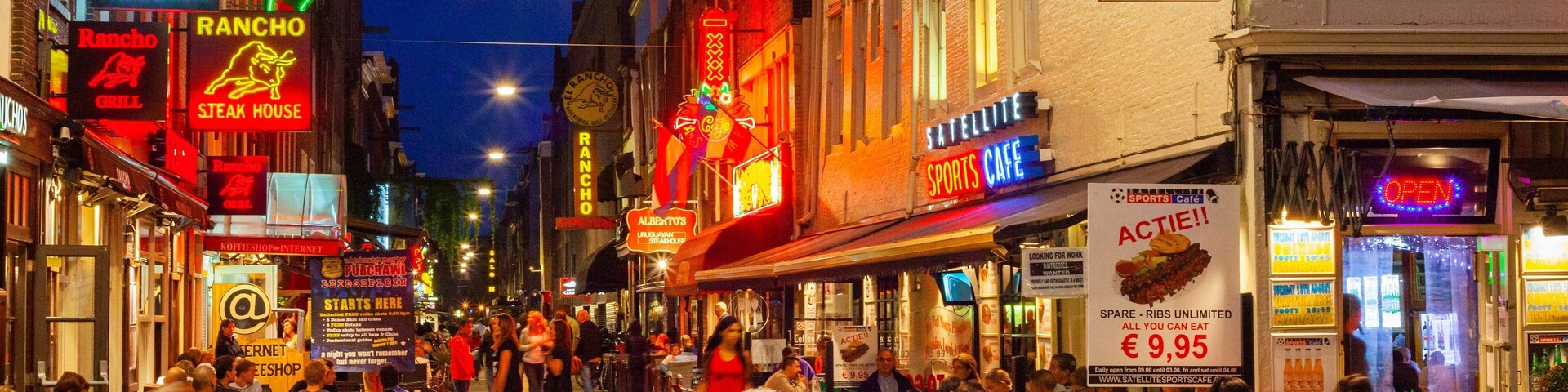 Leidseplein which includes a city, night scenes and street scenes