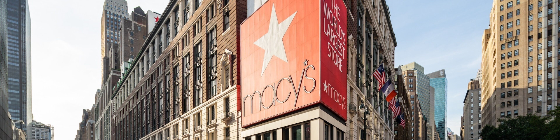 Macy\'s featuring signage, street scenes and a city