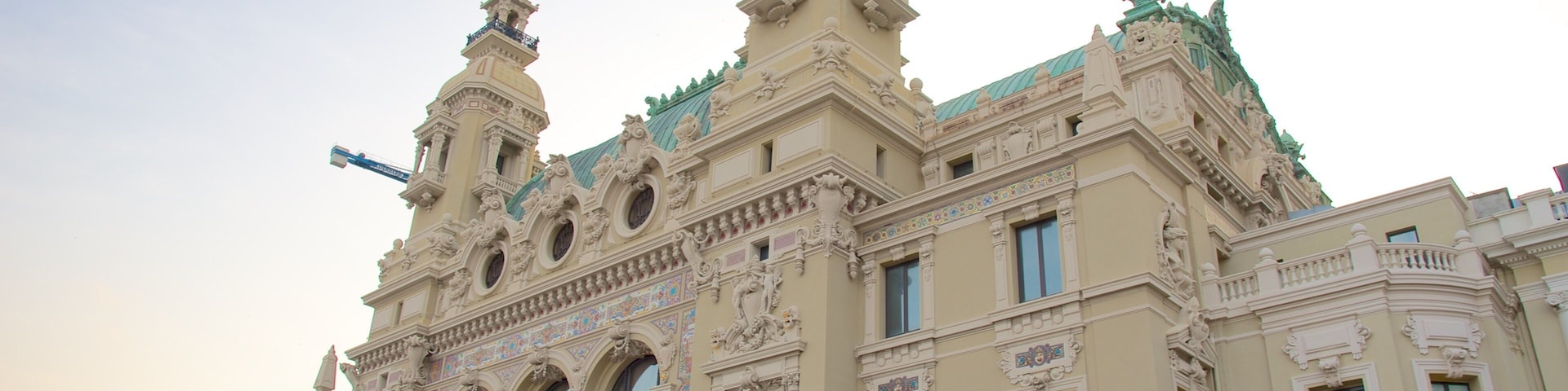 Salle Garnier Opera House which includes a sunset and heritage architecture