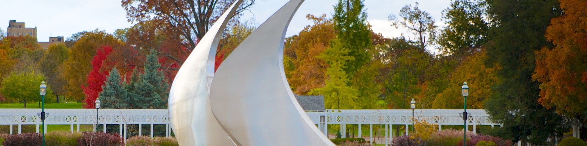 Franklin Park Conservatory and Botanical Gardens featuring a park and outdoor art as well as a small group of people