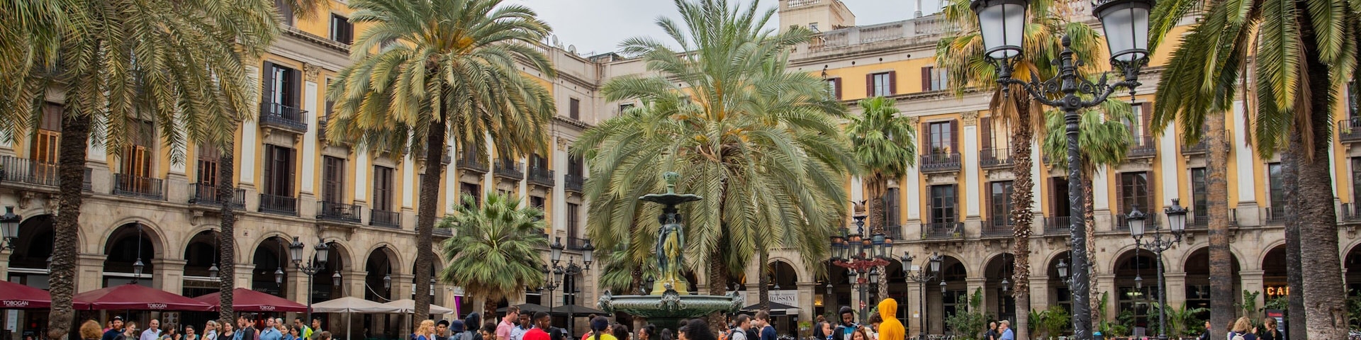 Plaça Reial featuring street scenes and a square or plaza as well as a small group of people