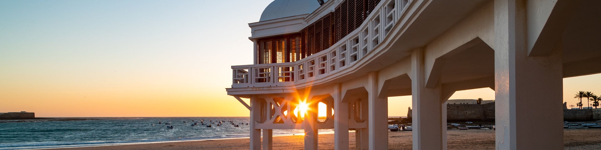 La Caleta Beach featuring a sunset, a beach and general coastal views