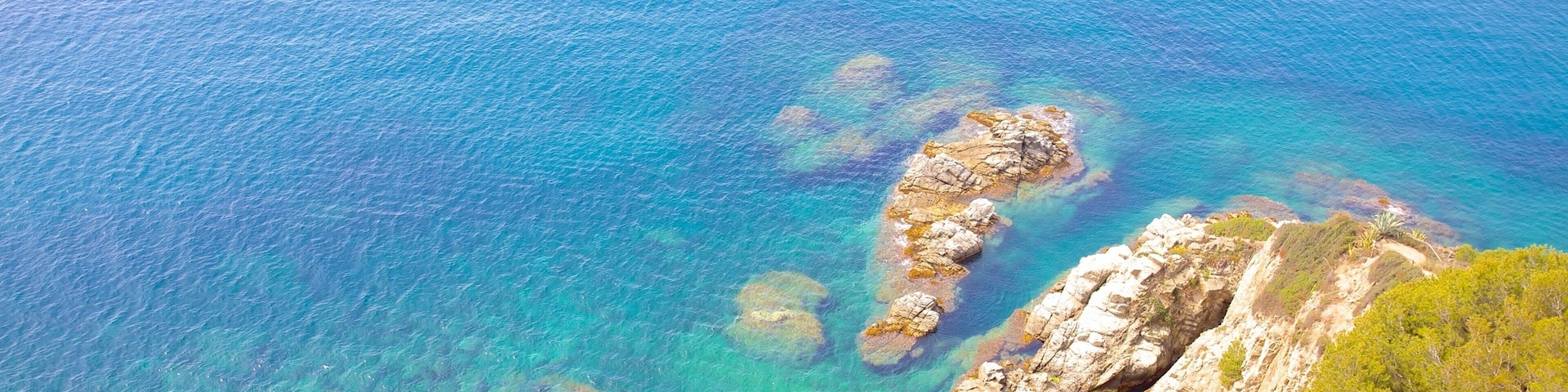 Sant Joan Castle featuring rugged coastline
